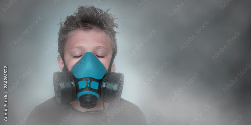 Young boy wearing gasmask, respirator portrait. Effects of worldwide ...