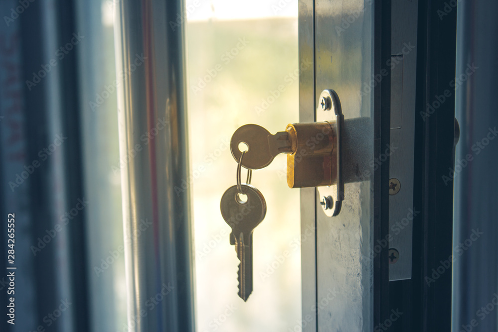 New keys are inserted into the door lock Stock Photo | Adobe Stock