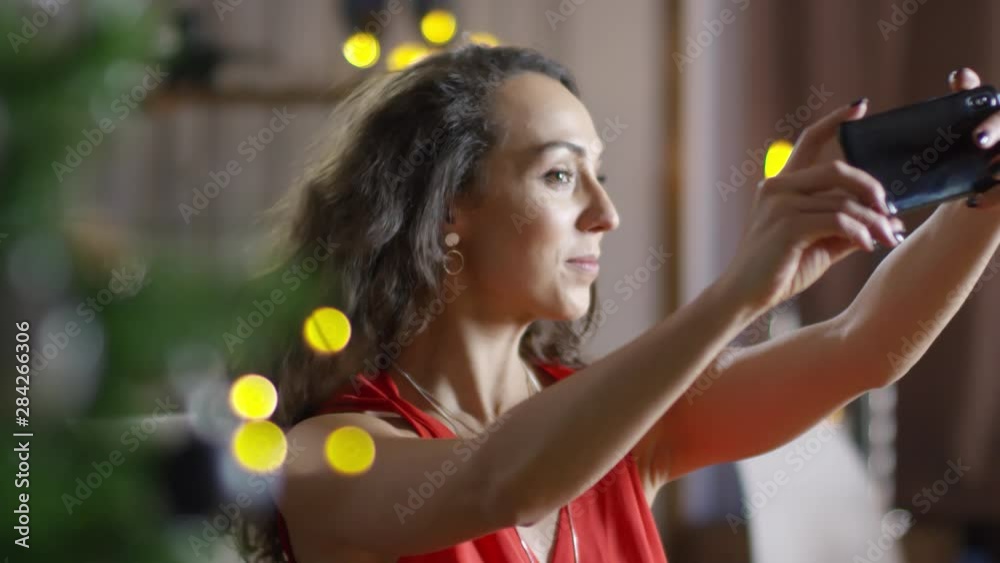 Chest-up shot with bokeh of beautiful young Caucasian woman in red ...