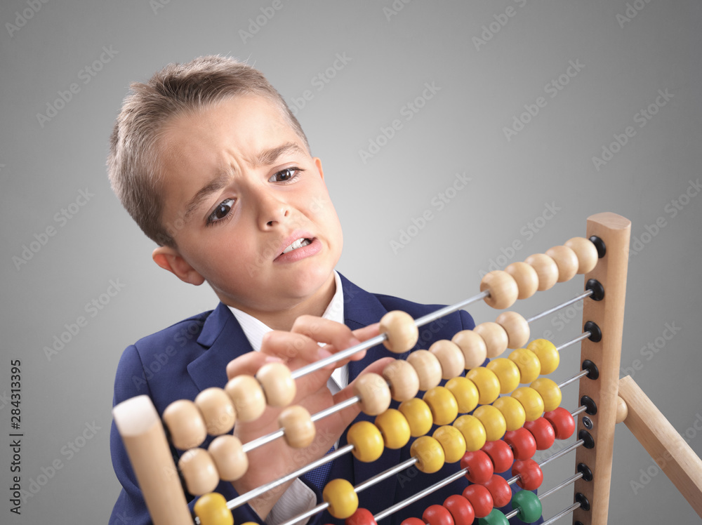 Young boy accountant businessman does calculation on a abacus Stock ...