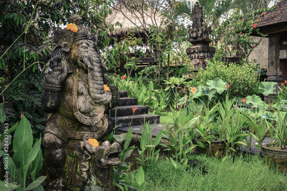 Stone Ganesha statue in garden Stock Photo | Adobe Stock