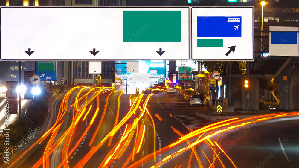 Empty Road Signs at night, long exposed car photo in big city, urban ...