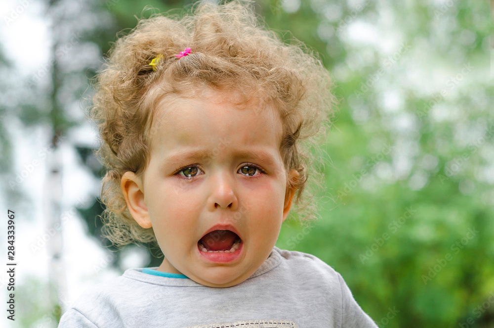 tears on eyes. little girl crying. offend the child. children's tears ...