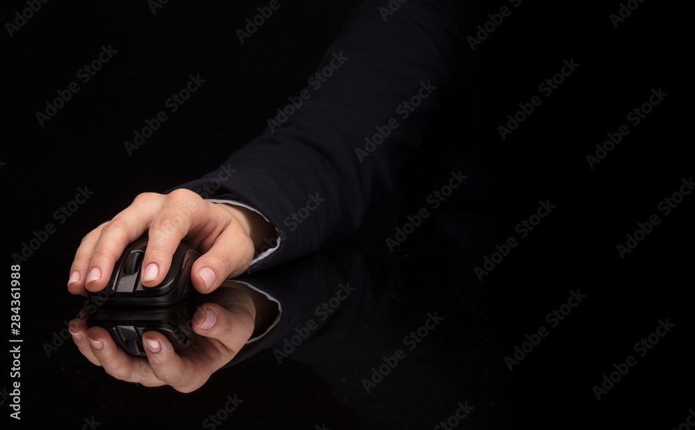 Hand using wireless mouse in a dark environment Stock Photo | Adobe Stock