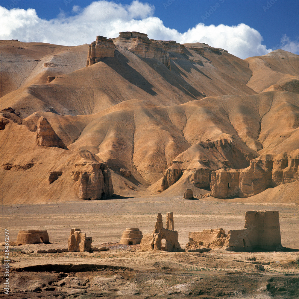 Afghanistan, Bamian Valley. Ancient earthen ruins blend seamlessly into ...