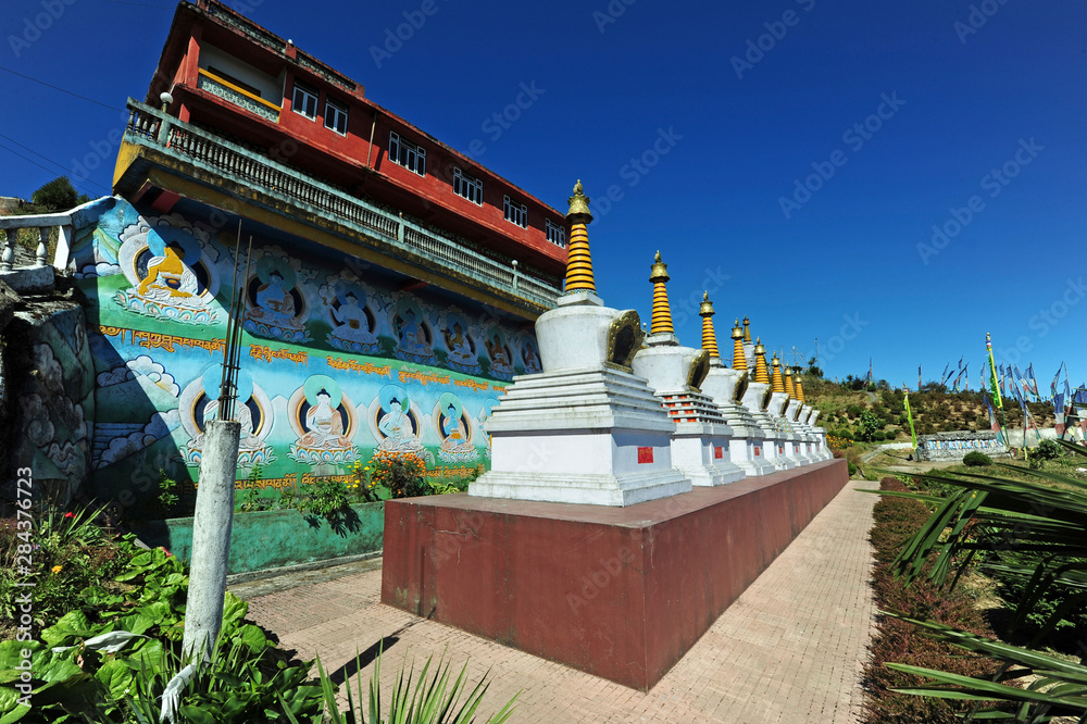 India, West Bengal, Meghma, Buddhist colorful script and stupa at the ...