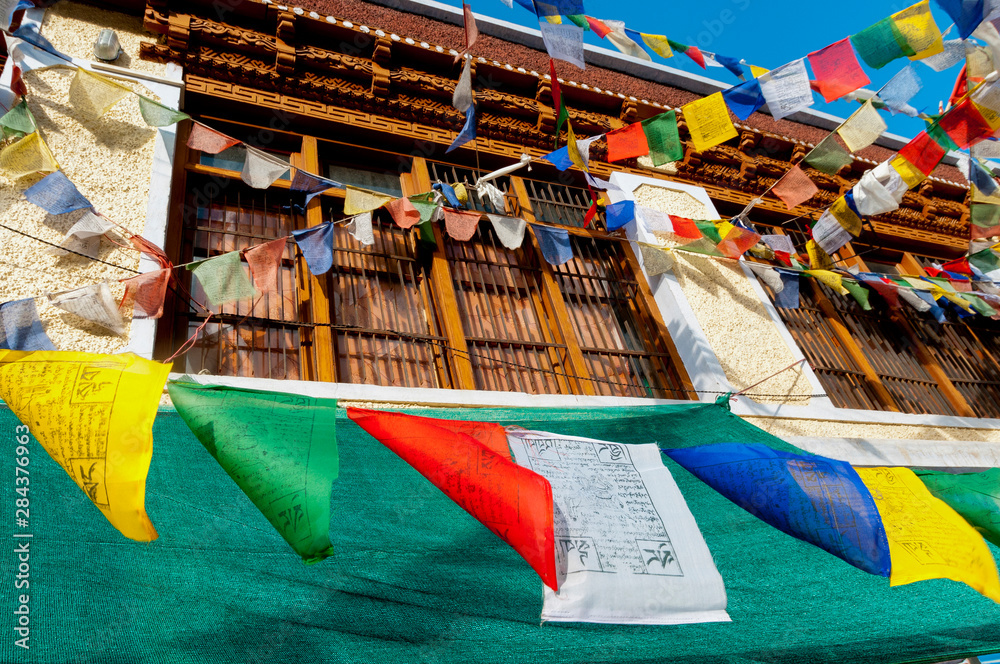 India, Jammu & Kashmir, Ladakh, prayer flags blowing in front of a ...