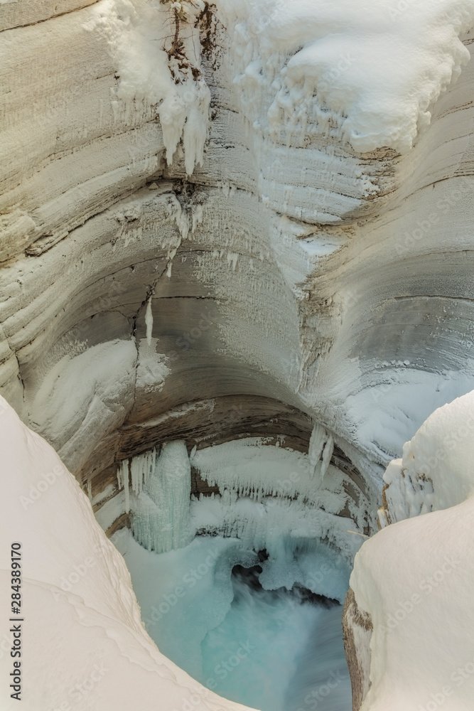 Grooved limestone walls of Mistaya Canyon in winter in Banff National ...