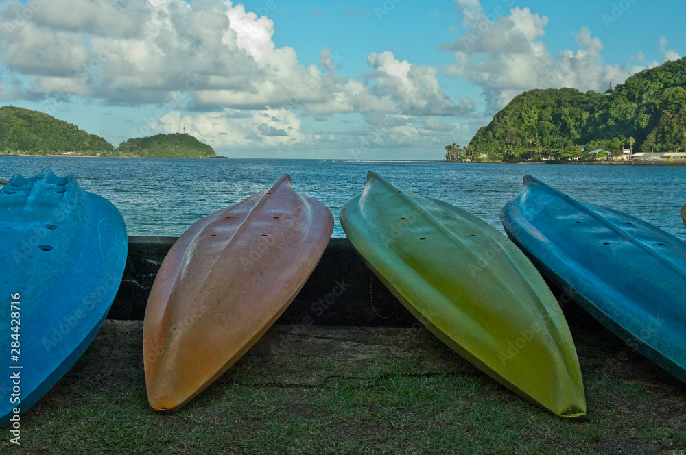 Colorful canoes on the beach in Pago Pago, Tutuila, American Samoa ...