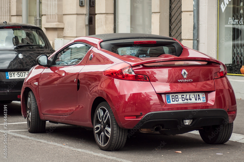 red Renault Wind parked in the street. The Renault Wind is a french ...