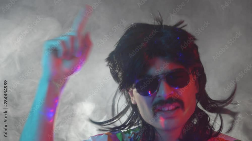 Man with mustache and mullet from the 70s 80s 90dancing in a party ...