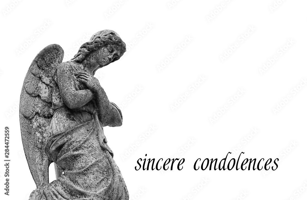 old stone statue of sad angel. stone memorial grieving angel statue on ...