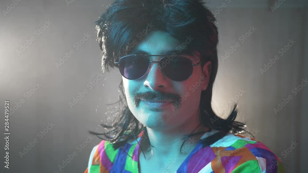 A man from the 70s 80s 90s with a mustache and a mullet hairstyle ...