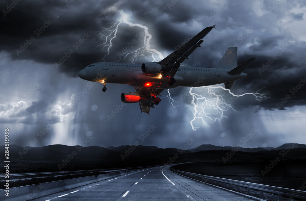 airplane flies in bad weather and storm with lightning bolt Stock Photo ...