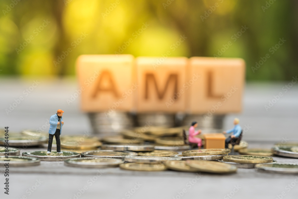 Money laundering concept. Miniature people, financial criminal on pile ...