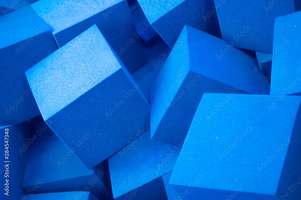 Randomly lying blue foam cubes. Graphic concept. Blue foam cut into ...