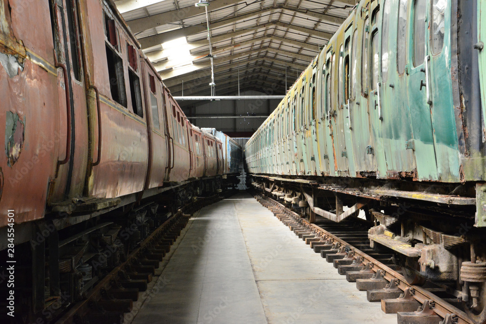 Rotten Railway carriages in a warehouse in the UK. Stock Photo | Adobe ...