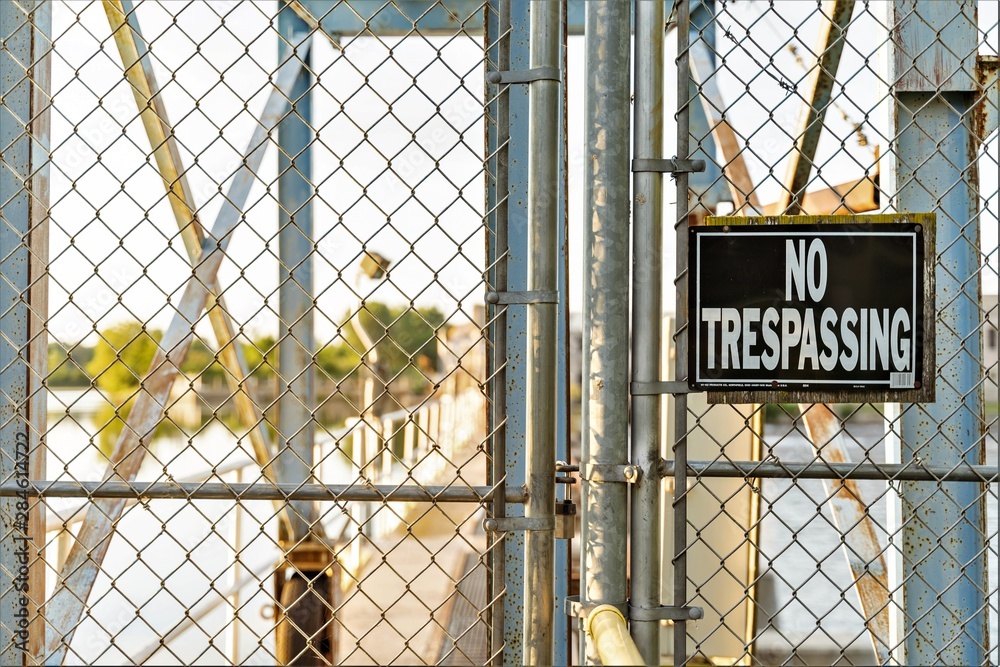 sign no trespassing warning sign on chain link wire fence Stock Photo ...