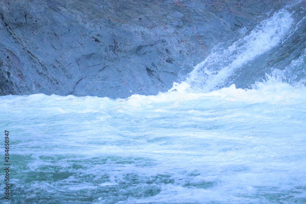 water falling between rocks from waterfalls Stock Photo | Adobe Stock
