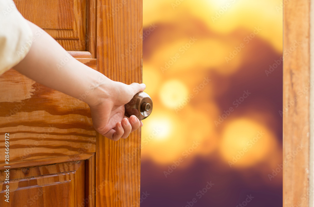 Women hand open door knob or opening the door,grand opening,Close up ...