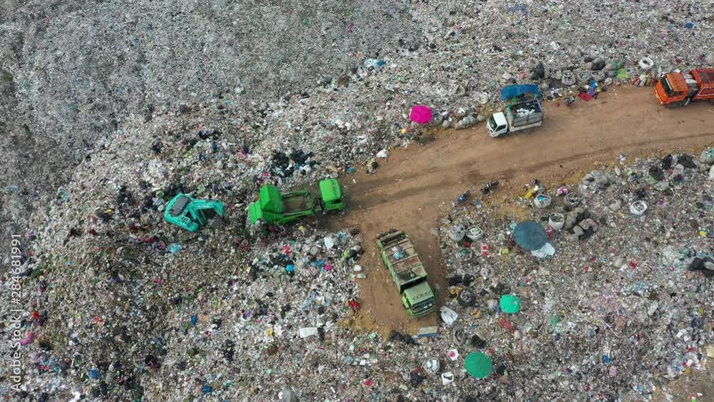 Garbage pile in trash dump or open landfill, Trash trucks dump waste ...