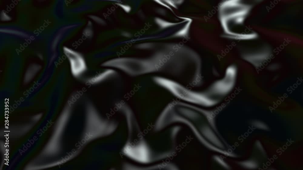 Abstract black silky fabric forms beautiful folds in the air in slow ...