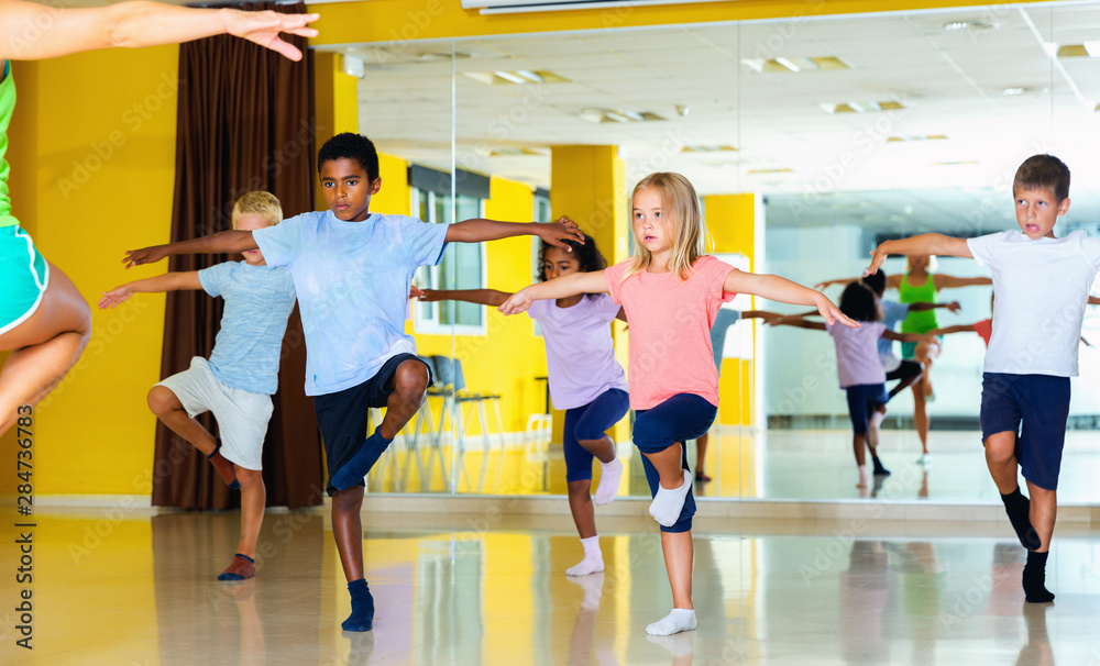 Preteen dancers practicing dance routine with female choreograph Stock ...