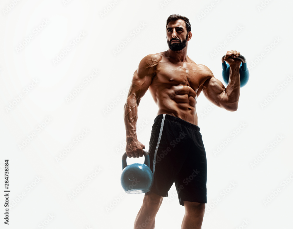 Strong Muscular Men Exercise With Kettlebells as part of His Cross ...