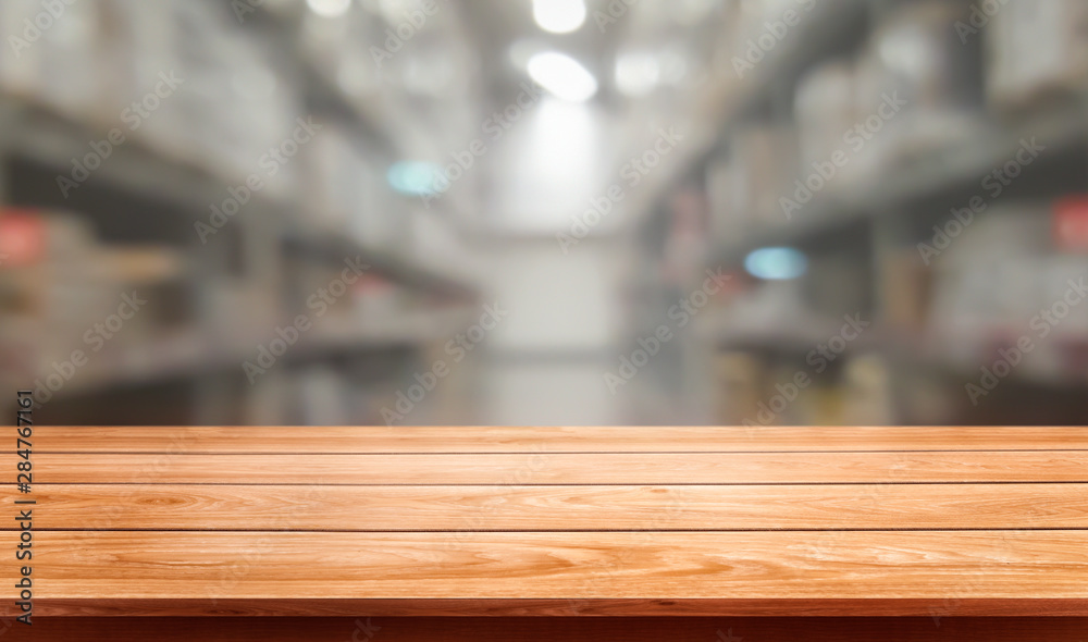 Wood table in warehouse storage blur background with empty copy space ...
