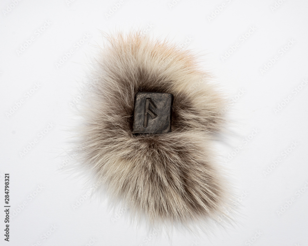 Norse rune Ansuz, isolated on fur and white background. The voice of ...