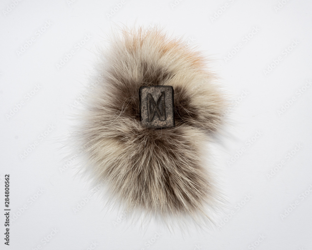 Norse rune Dagaz (Dagr), isolated on fur and white background. Dawn ...