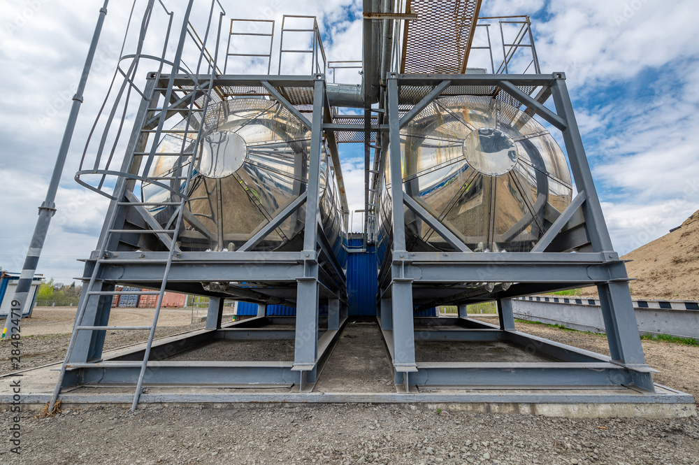 Street tanks for storing various liquids. Tanks are connected by many ...