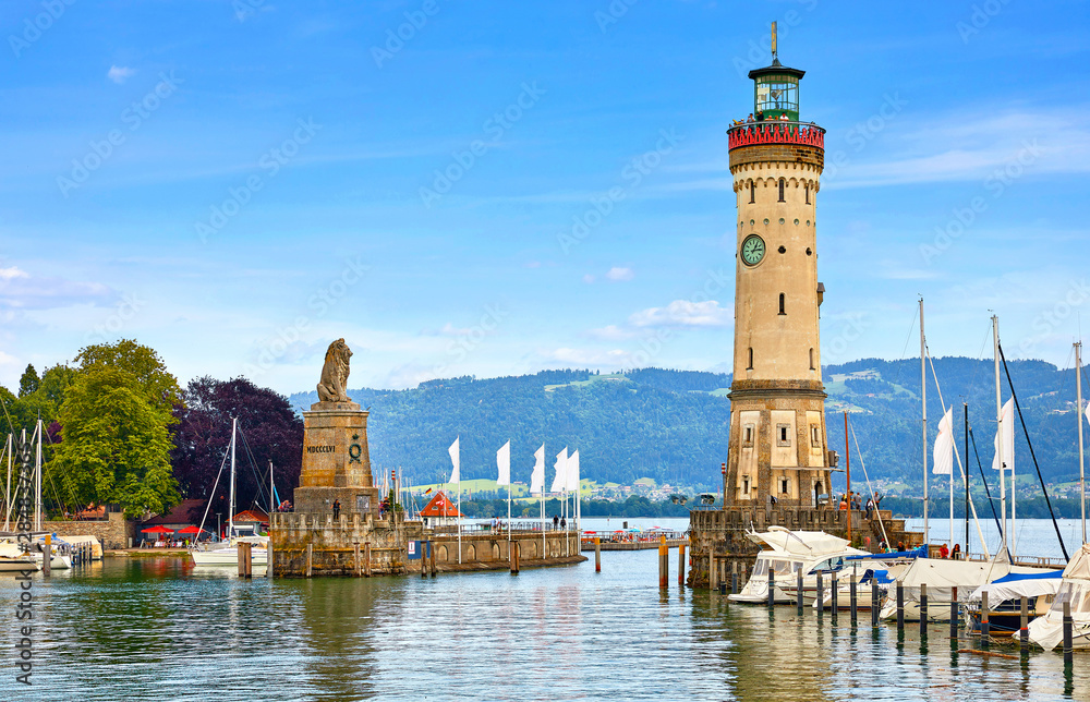 Lindau, Germany. Old lighthouse with clock in bay. Antique bavarian ...
