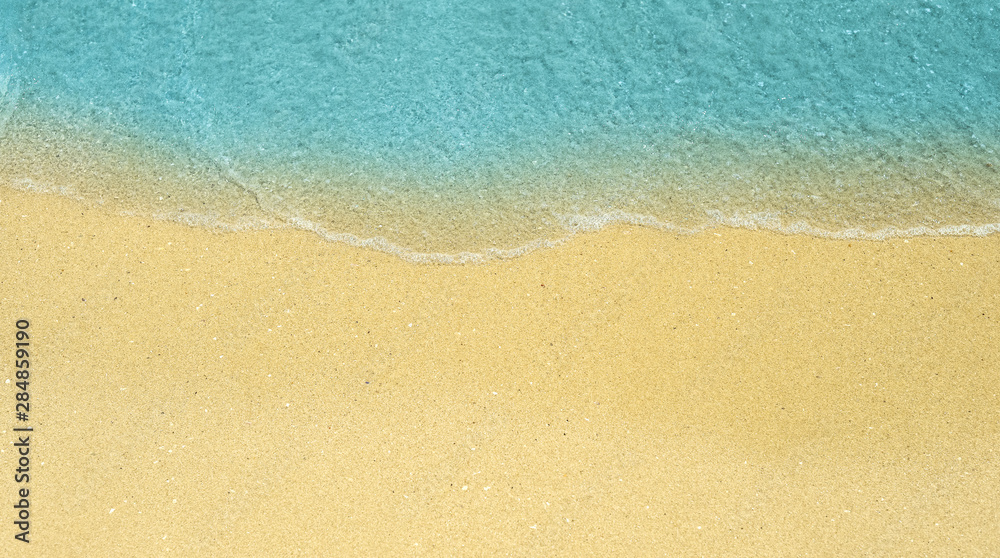 Deep blue water, waves and sandy beach. Beautiful coastline with copy ...