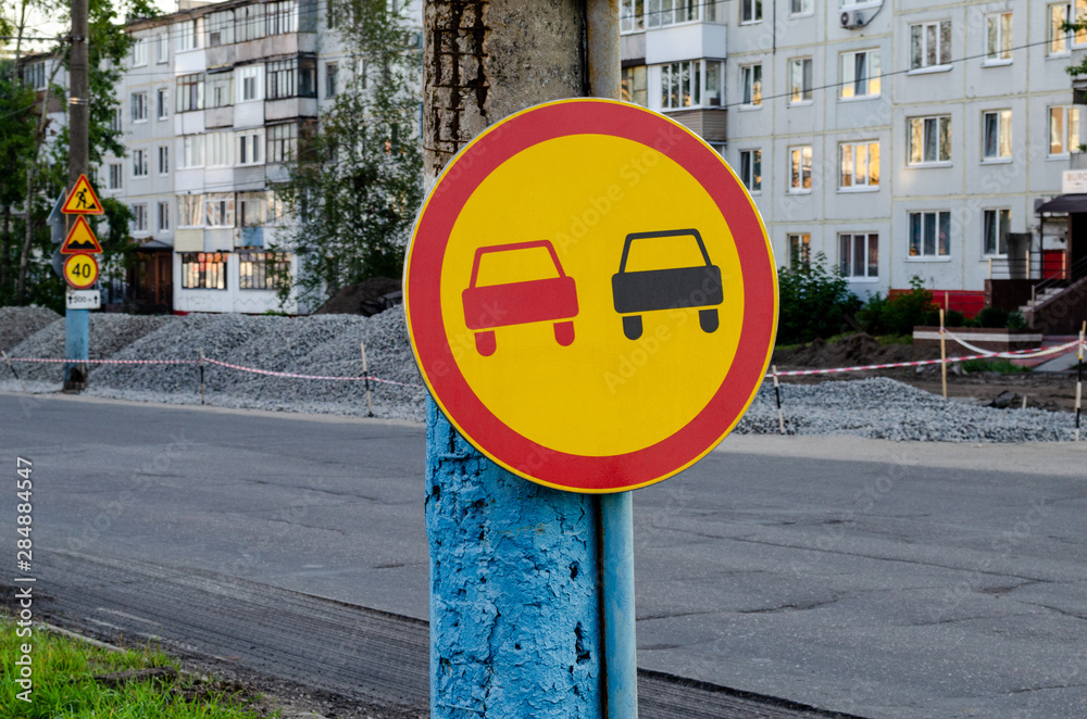 Road sign Overtaking is prohibited. Repair work on the repair of the ...
