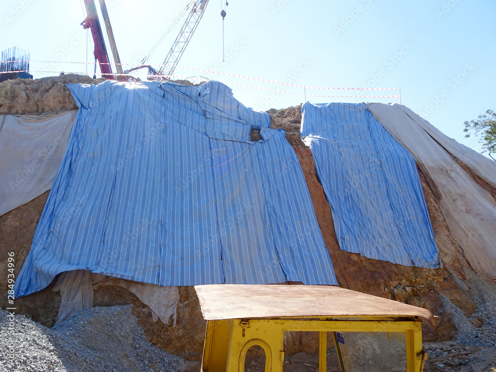 Temporary slope protection during construction using the plastic sheets ...