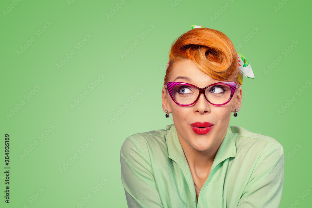 Wow. Excited pin up girl looking up to the side Stock Photo | Adobe Stock