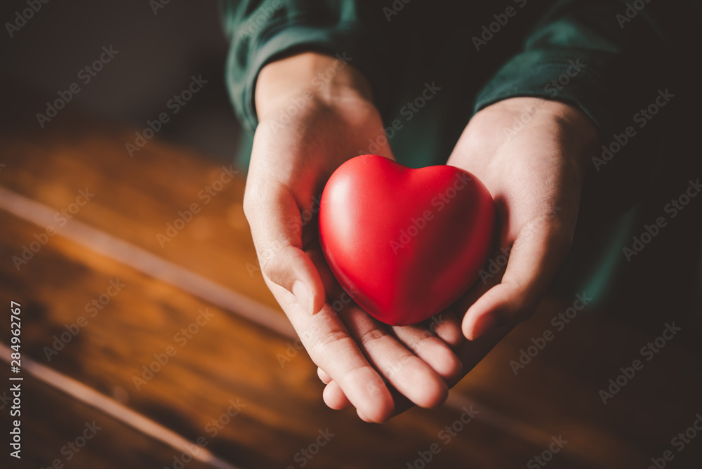 Hand give red heart for love Stock Photo | Adobe Stock