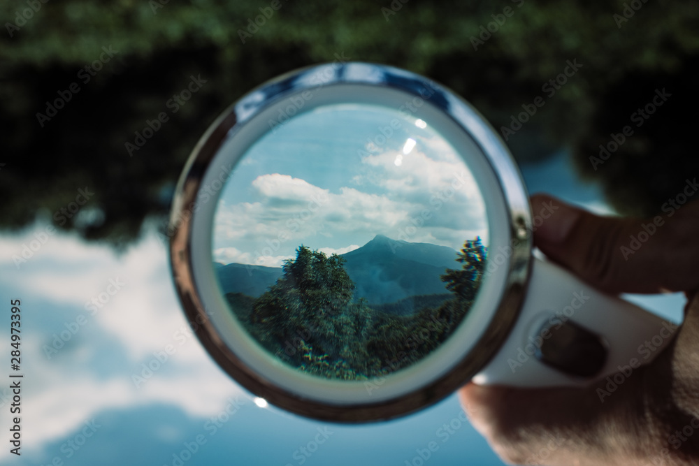 Handheld Loupe optical magnification effects view upside down on a ...