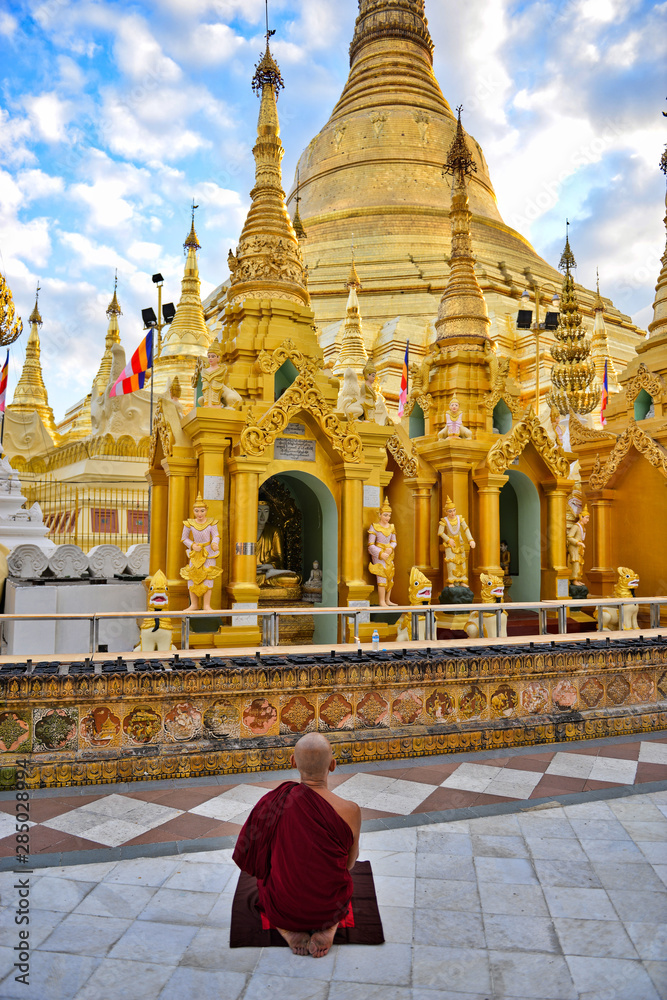 Poster buddhist pilgrims dressed in red traditional robes praying in ...