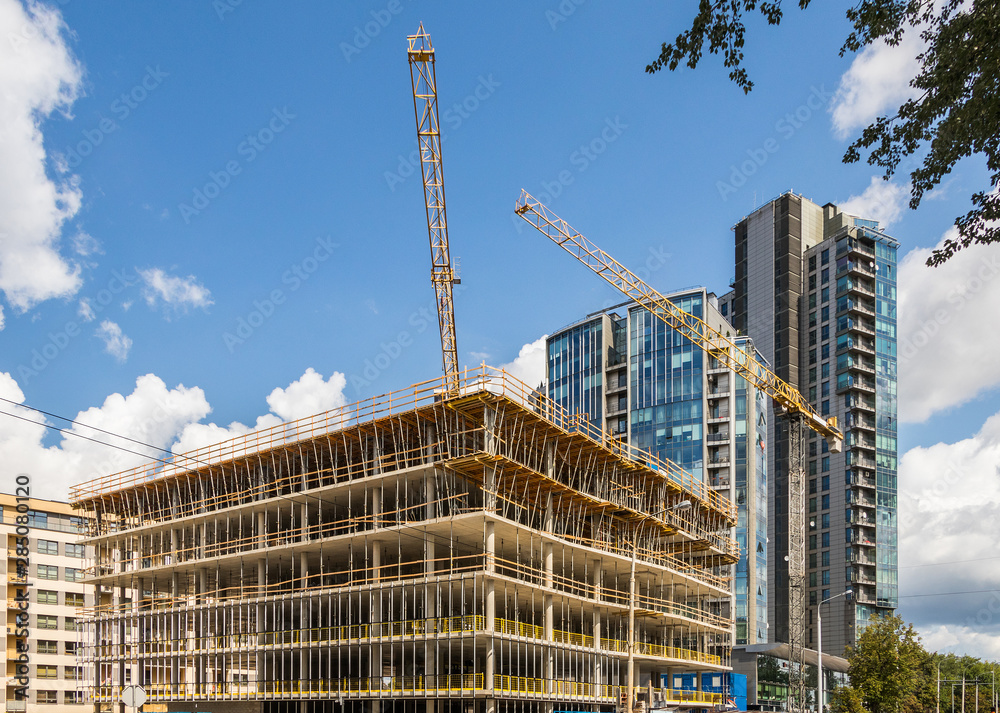 Reinforced concrete building frame on scaffolding against the backdrop ...