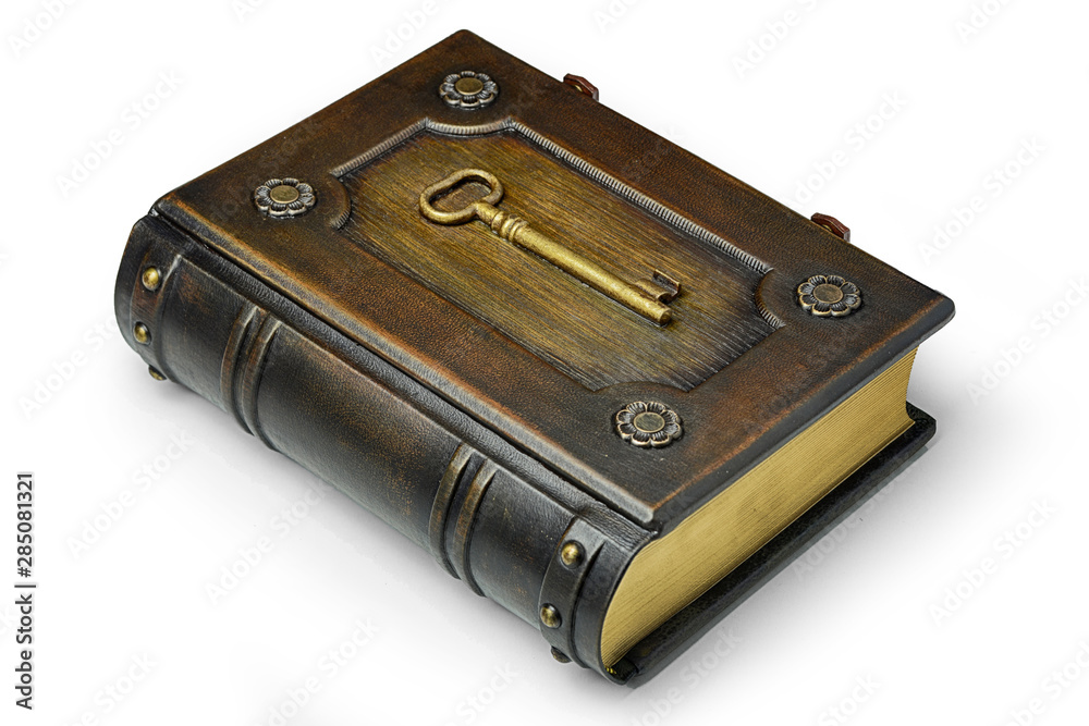 Leather book with the key fitted to the oak wooden plate in the center ...