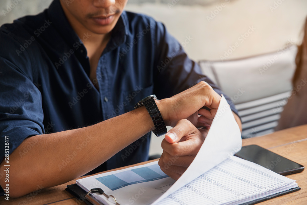 Professional Business man seeing wrist watch to check time at office ...