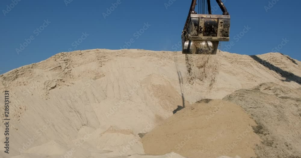 Extraction of river sand. Gantry cranes on the riverport loads sand ...