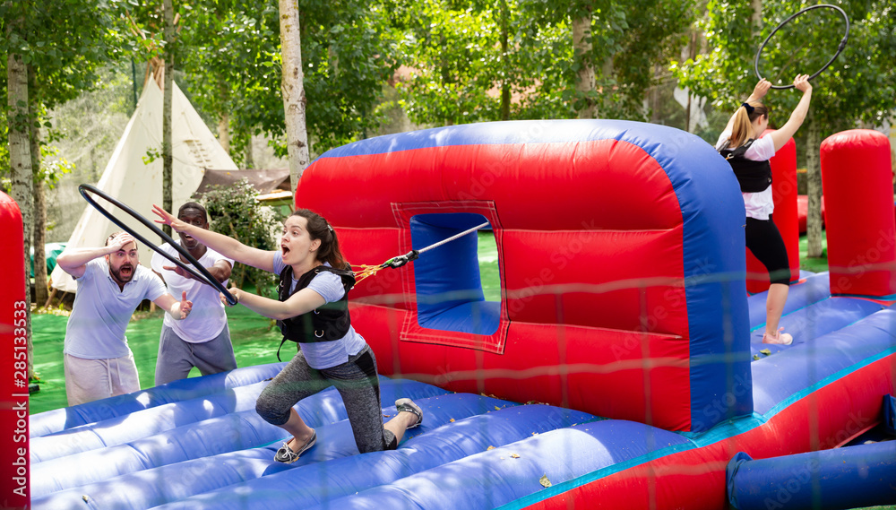 Competition of two women - who quickly throw a hoop on a stick Stock ...