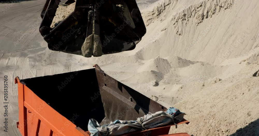 Extraction of river sand. Gantry cranes on the riverport loads sand ...