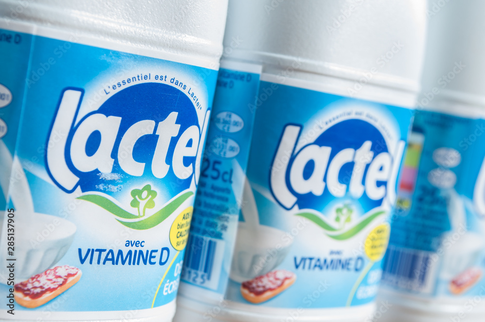 closeup of milk bottles of Lactel brand - Lactel is the french brand ...