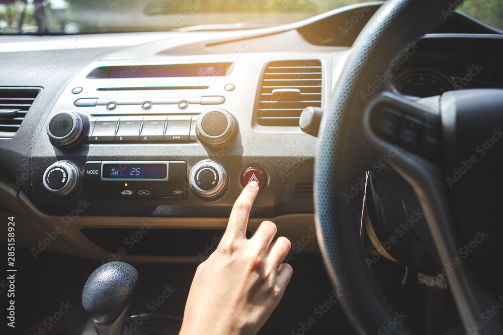 Use the hand to press the emergency button in the car Stock Photo ...
