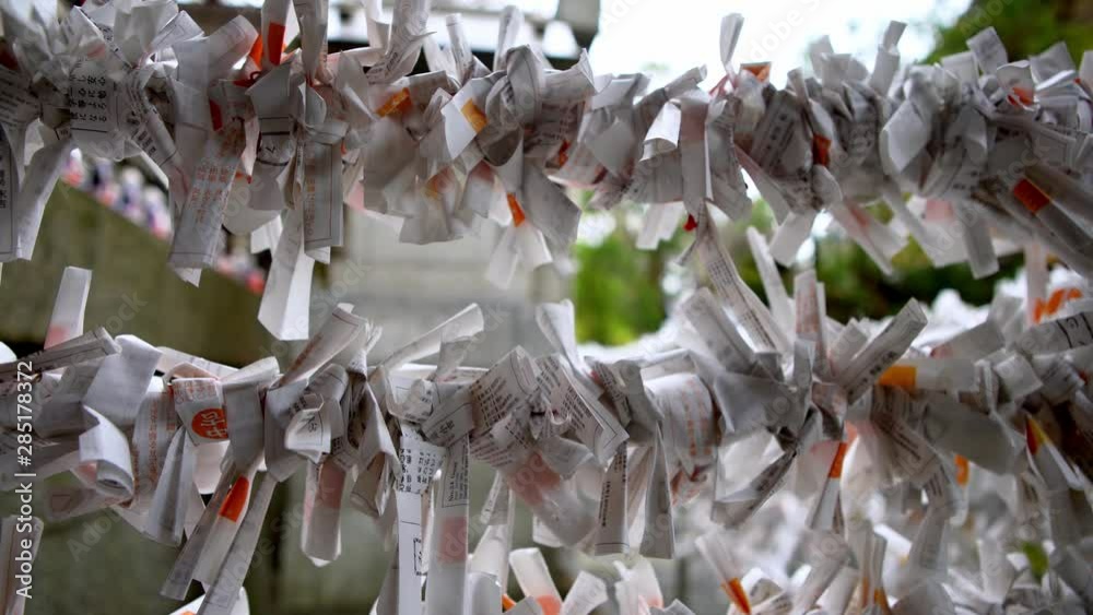 4K, Omikuji paper with bad fortune at famous grounds of Fushimi Inari ...