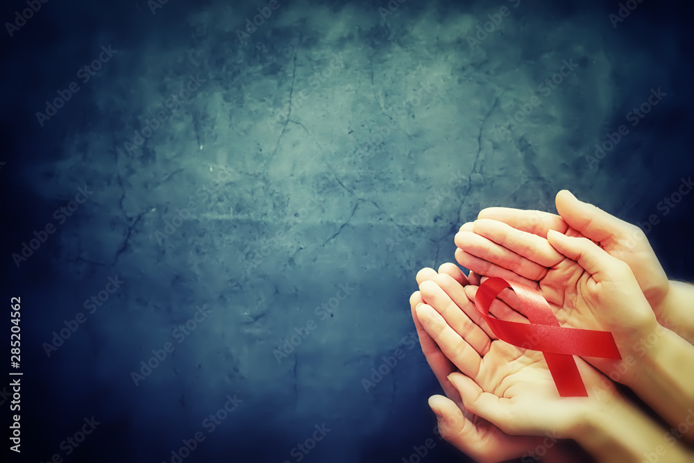 Symbol of human immunodeficiency virus disease. Red ribbon. A helping ...